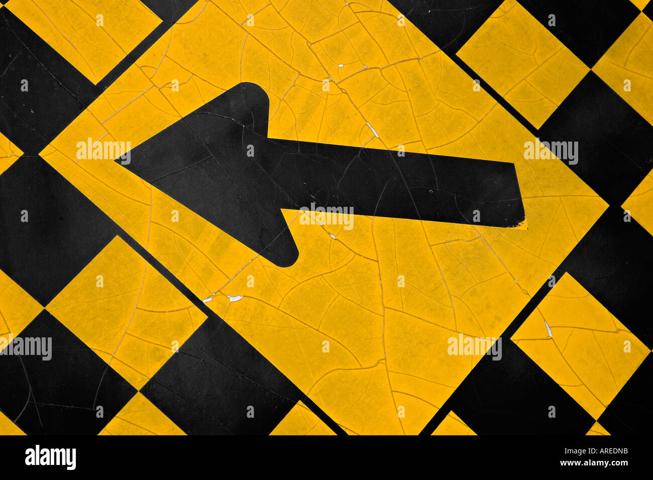 Close up detail of a directional arrow pointing left in the center of a ...