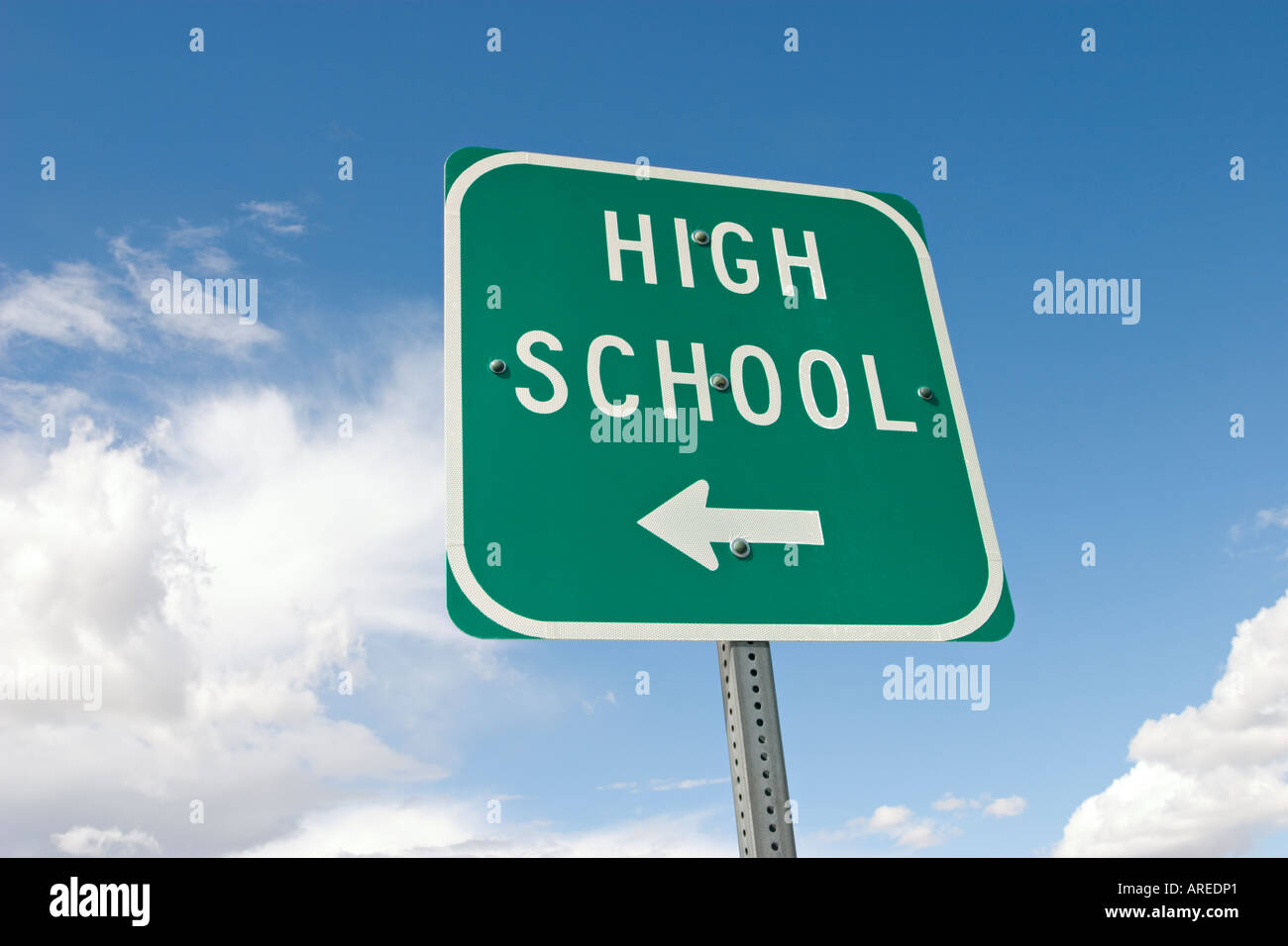 HIGH SCHOOL sign with directional arrow pointing left Stock Photo - Alamy