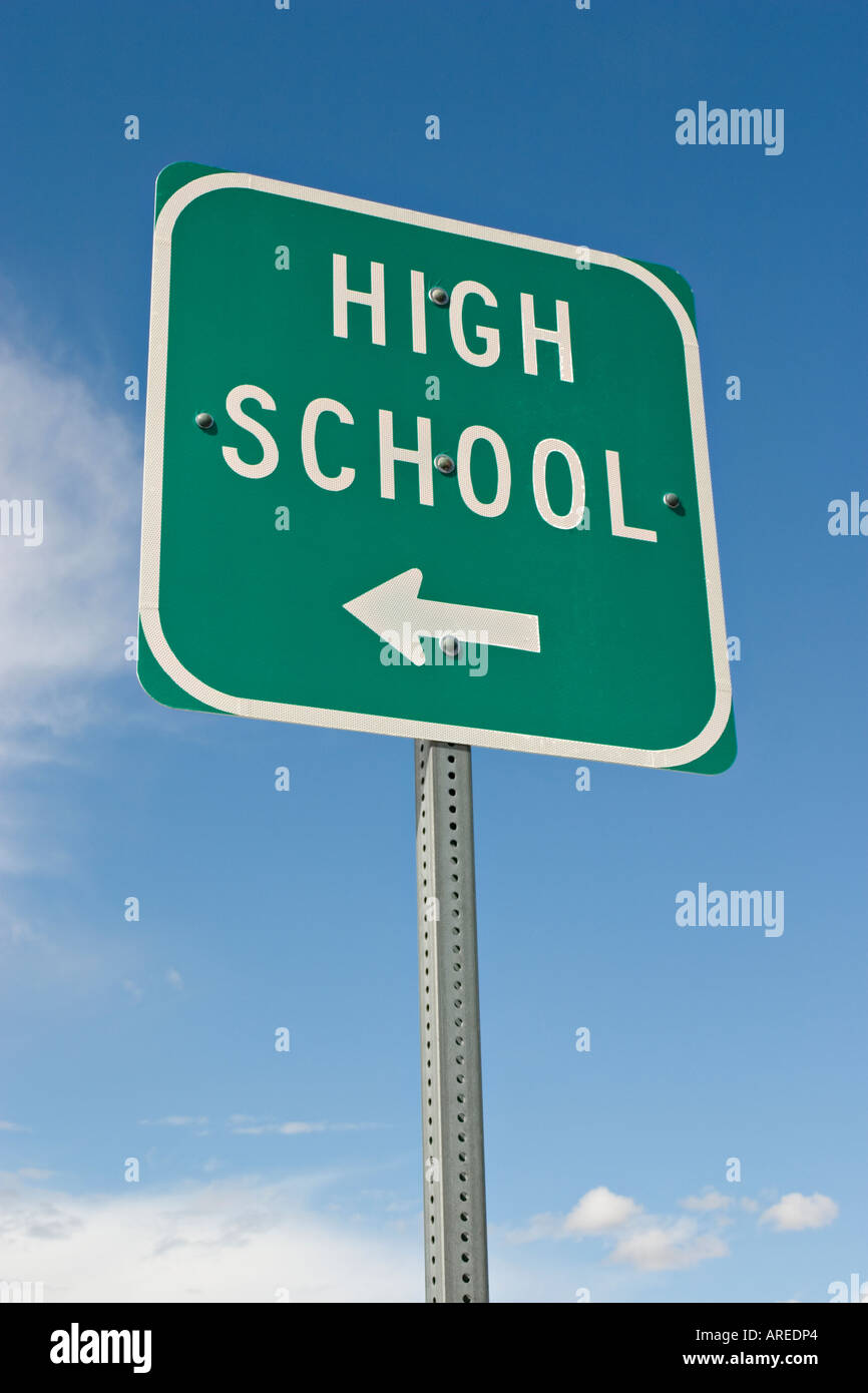 HIGH SCHOOL sign with directional arrow pointing left Stock Photo - Alamy