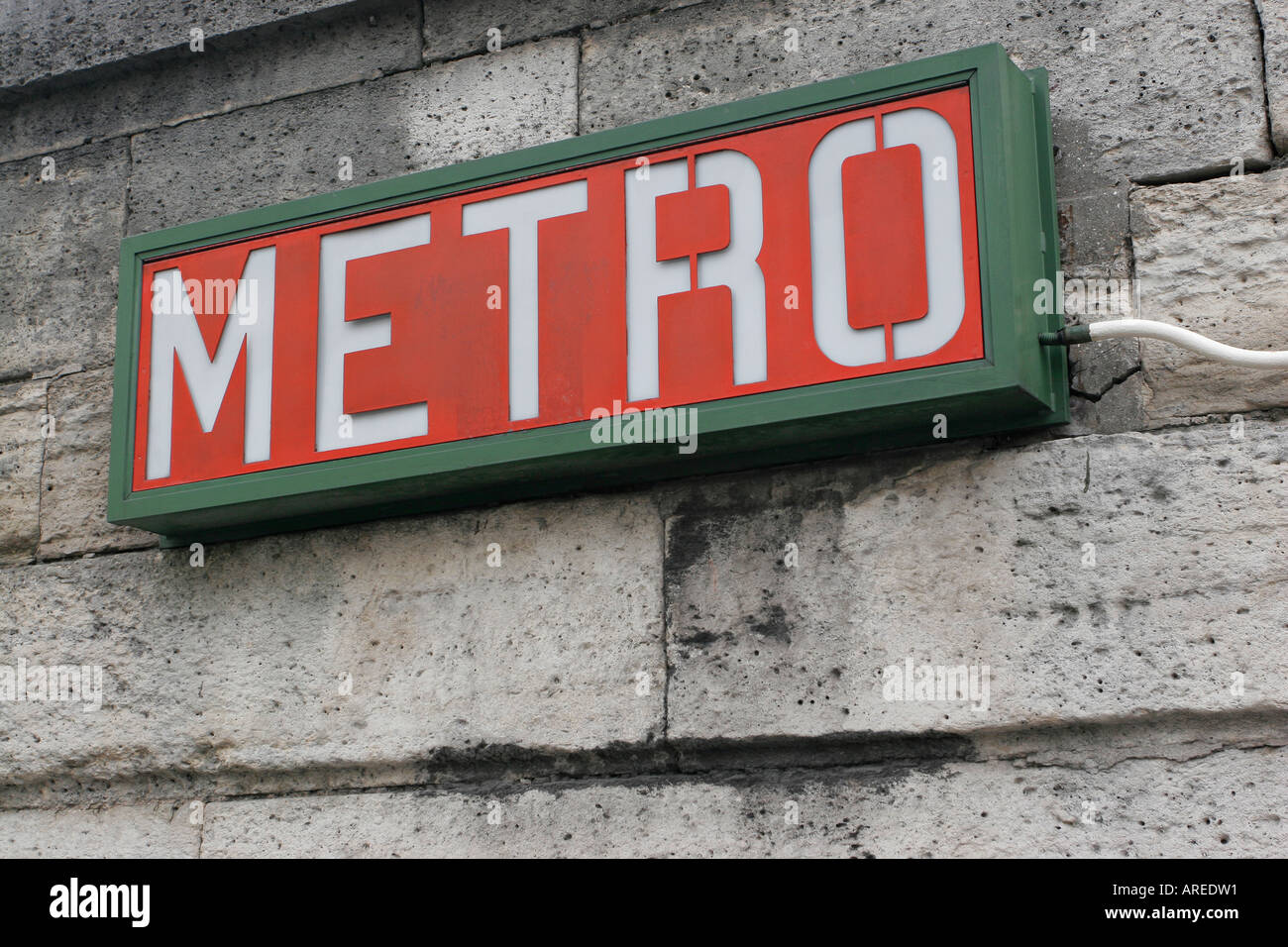 Red and green Paris Metro sign on an old stone wall Stock Photo - Alamy