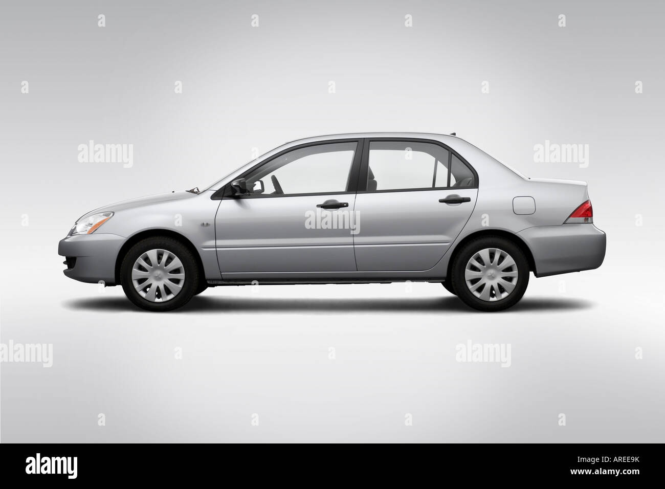 2006 Mitsubishi Lancer ES in Silver - Drivers Side Profile Stock Photo ...