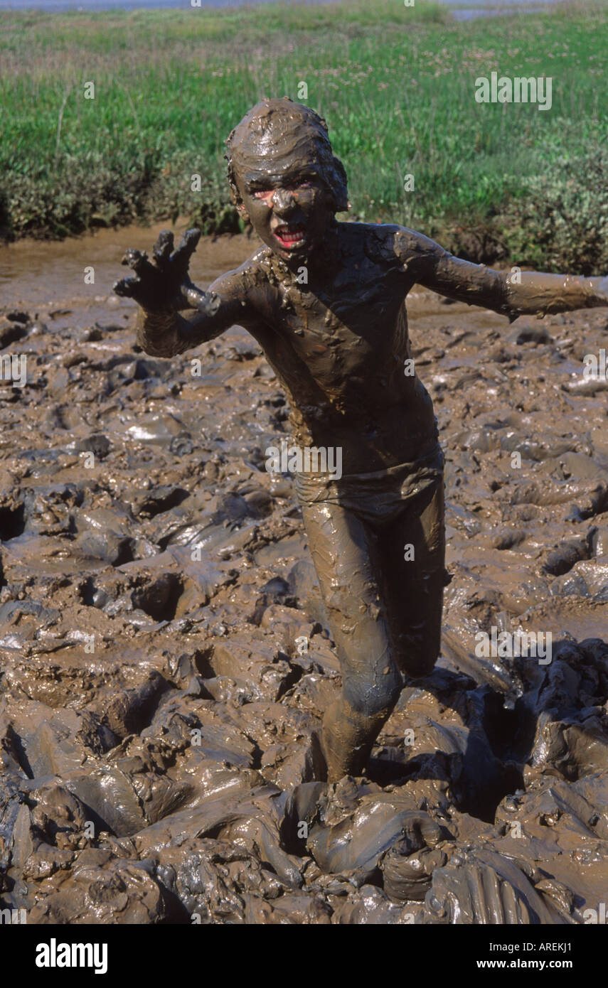 Child playing in mud pool Stock Photo - Alamy
