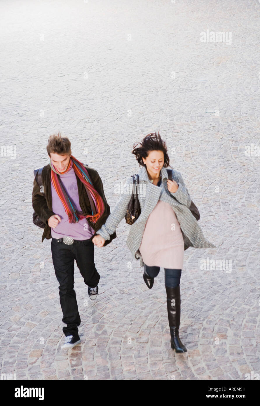 Man and woman hand in hand Stock Photo - Alamy