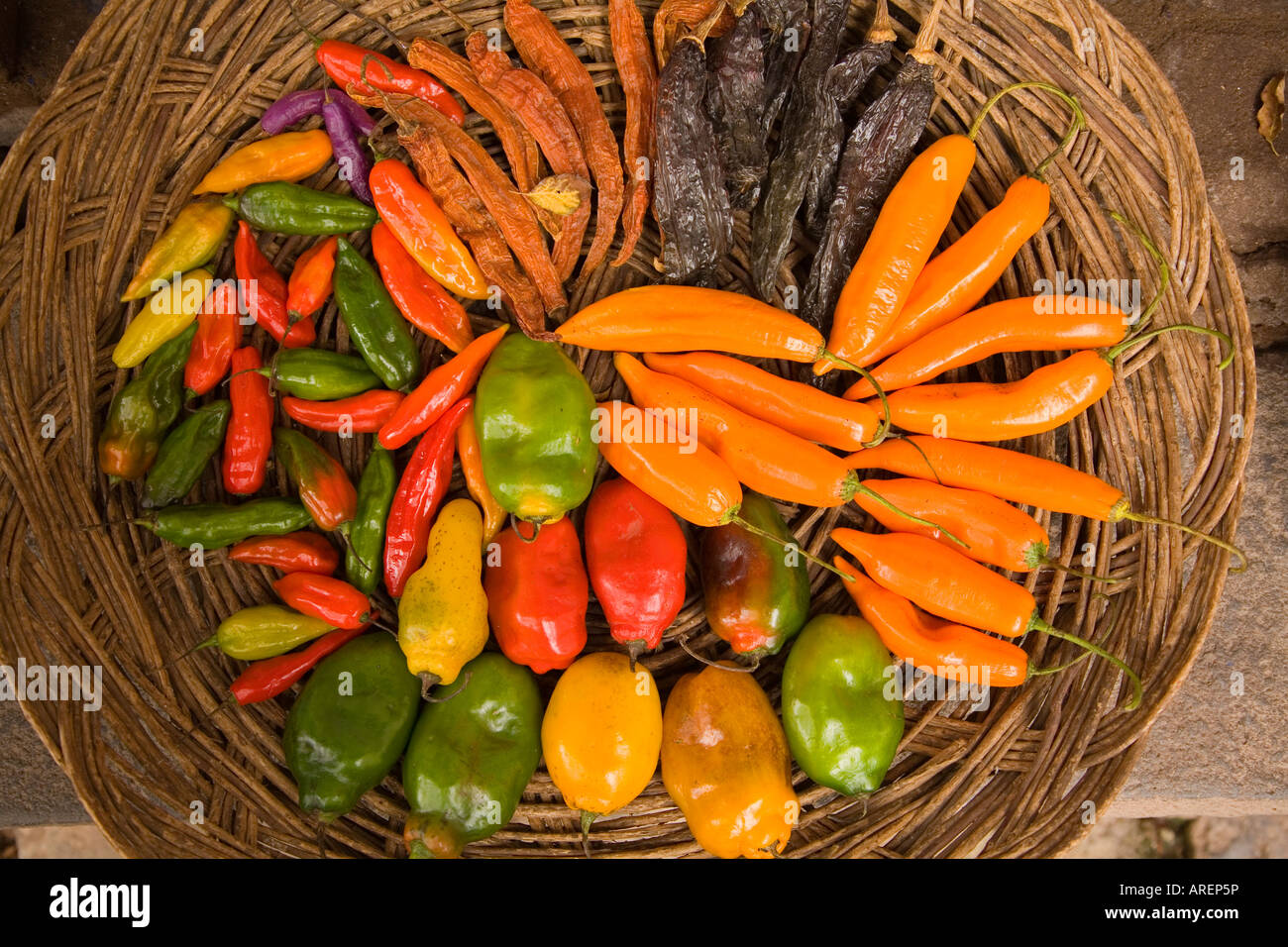 Colorful peppers in a basket Stock Photo - Alamy