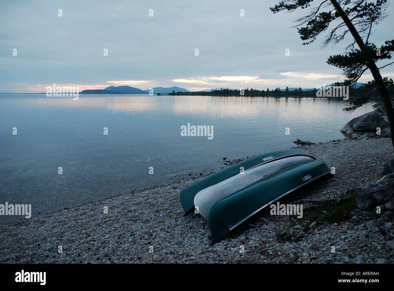 Canoes on the beach of Lake Rogen in the Rogen National Park Harjedalen ...
