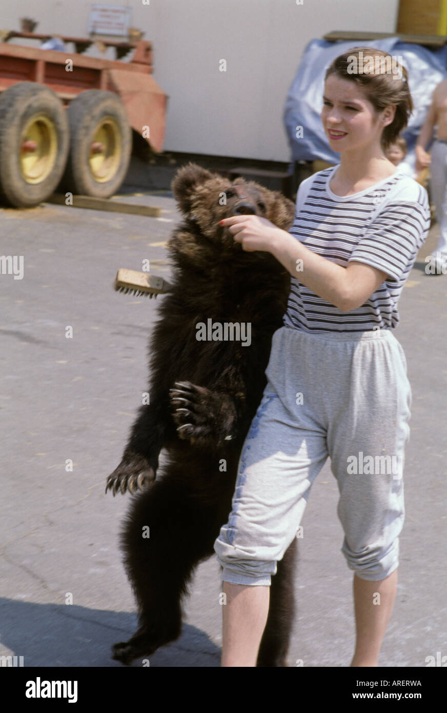 Female animal trainer w small bear Stock Photo - Alamy