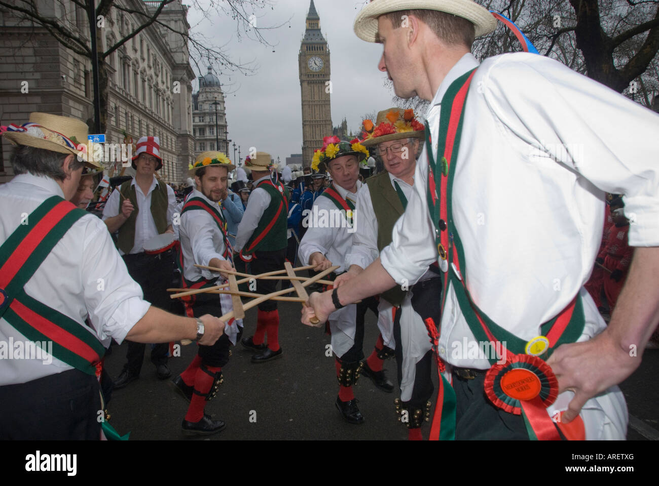Morris Dancers perform sword dance on street in front of UK Houses of ...