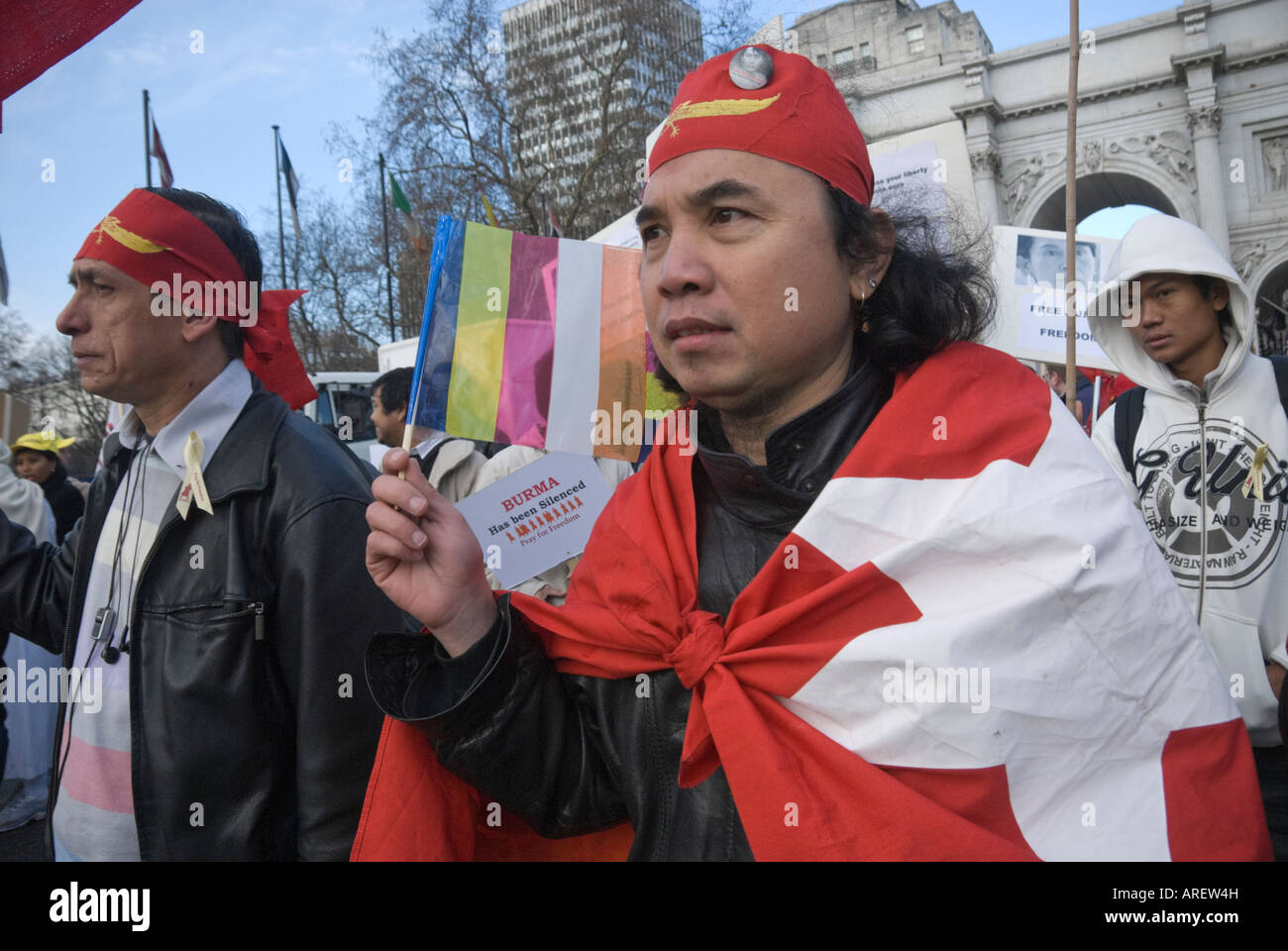 Burmese man wearing Freedom flag and red fighting peacock hat with ...
