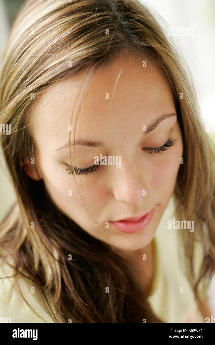 Young girl looking sad Stock Photo - Alamy