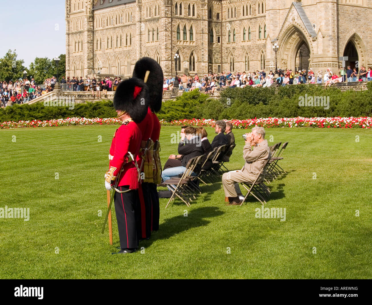 Officers and family watch the Changing of the Guard Ceremony in Ottawa ...