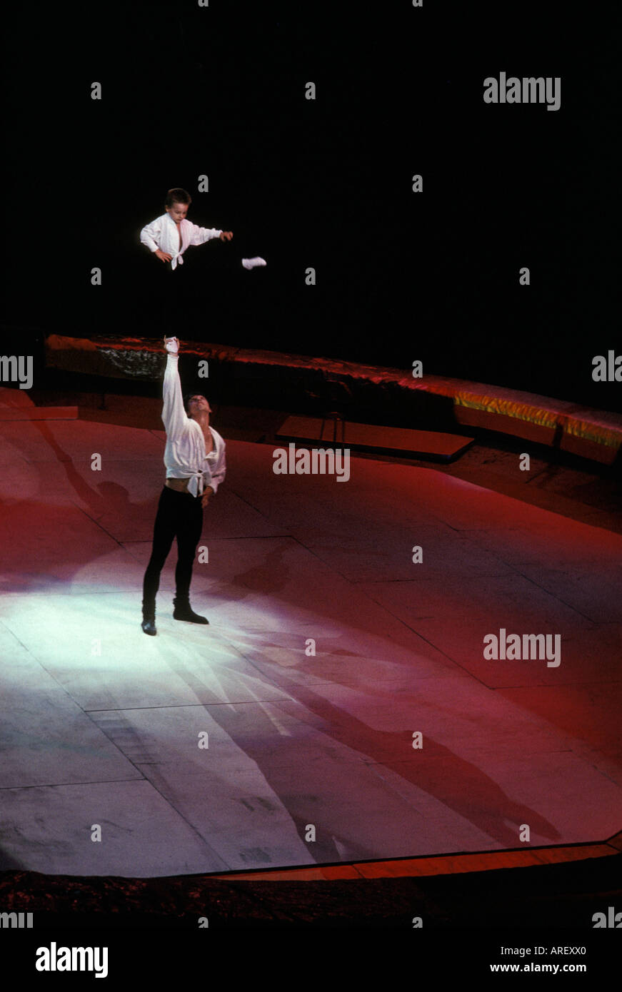 circus performer acrobat balance young boy father son Stock Photo - Alamy