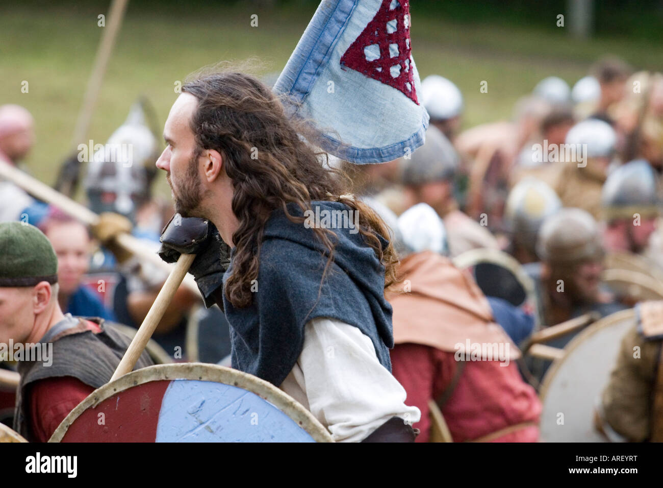 Viking flag bearer in the midst of a battle re-enactment in Denmark ...