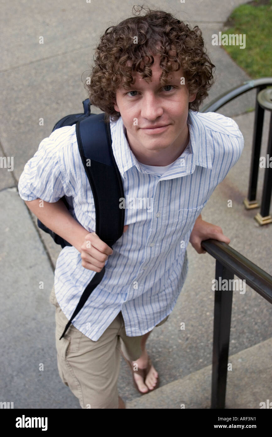 College student walking up steps Stock Photo - Alamy