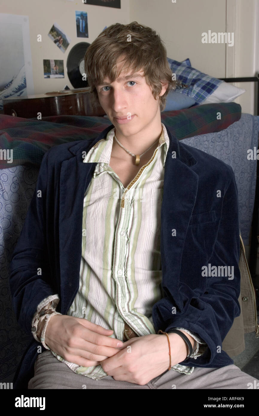 College boy sitting in chair in his dorm room Stock Photo - Alamy