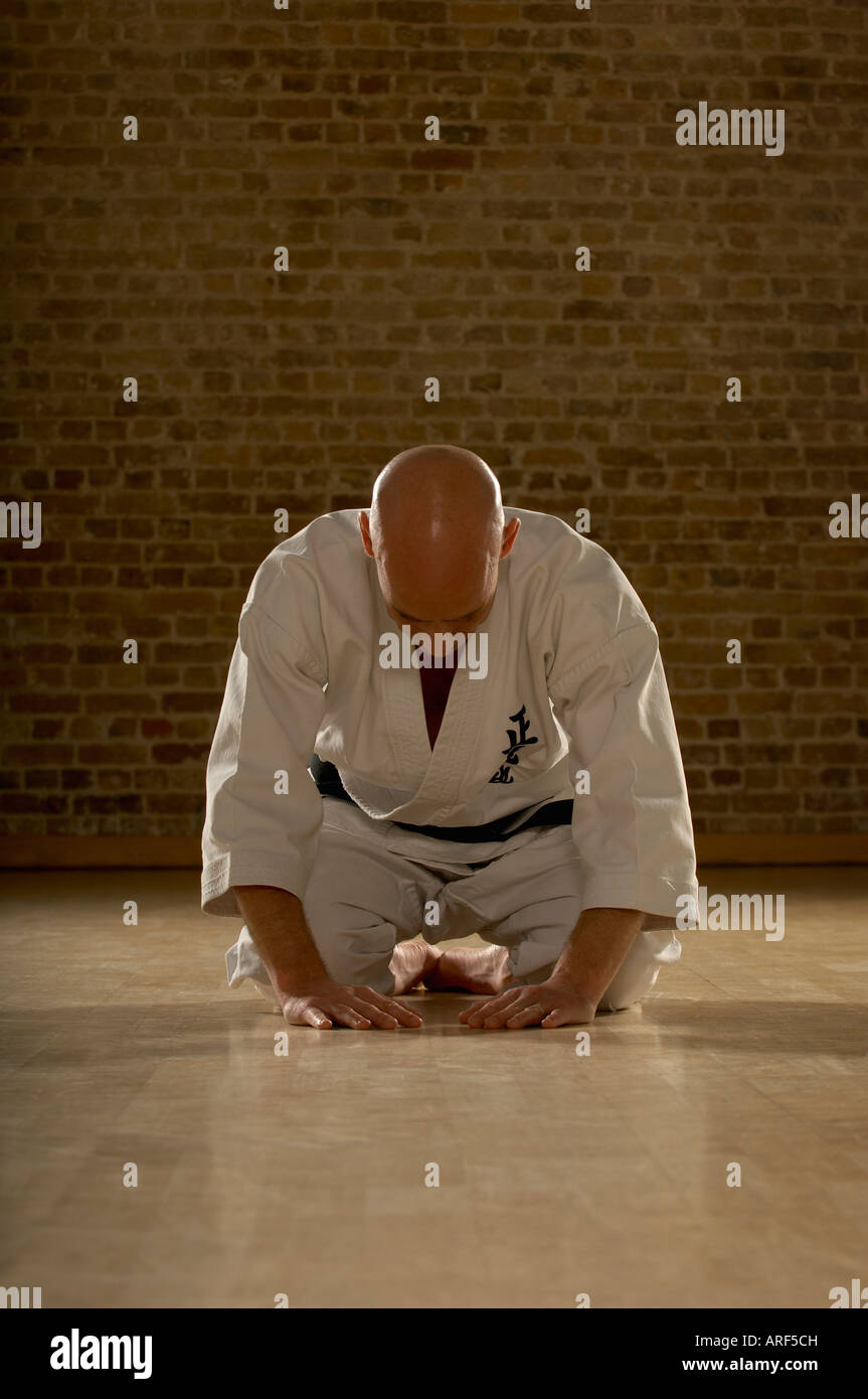 Karate man bowing Stock Photo - Alamy