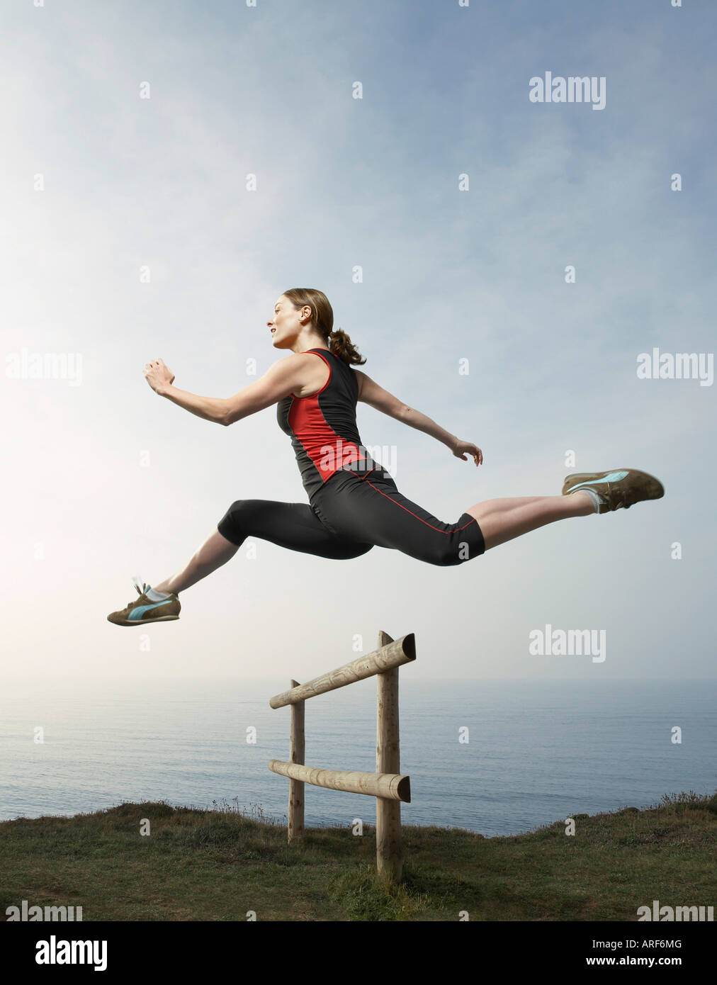 Hurdling woman sky hi-res stock photography and images - Alamy
