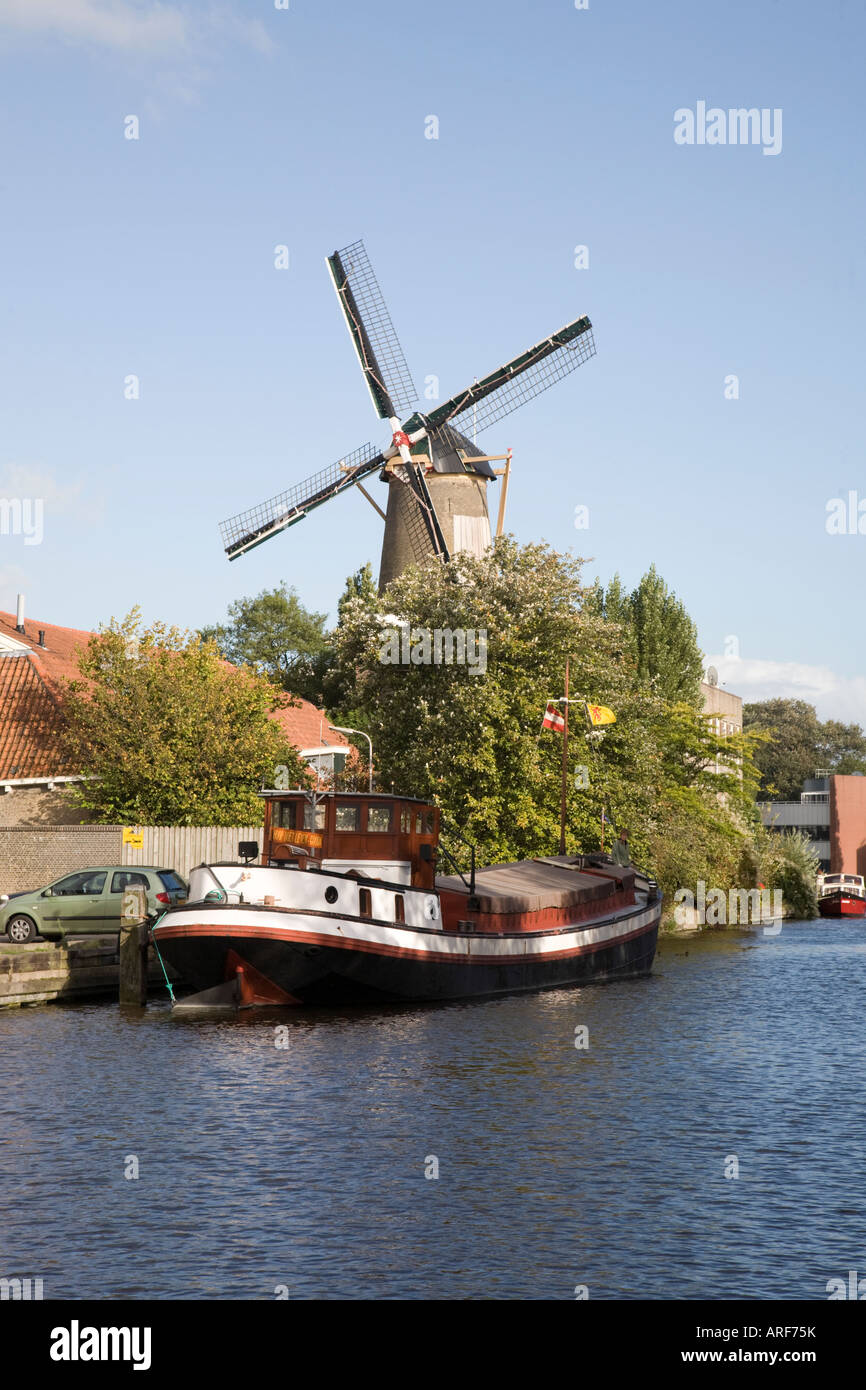 Gouda Windmill and Barge Stock Photo - Alamy