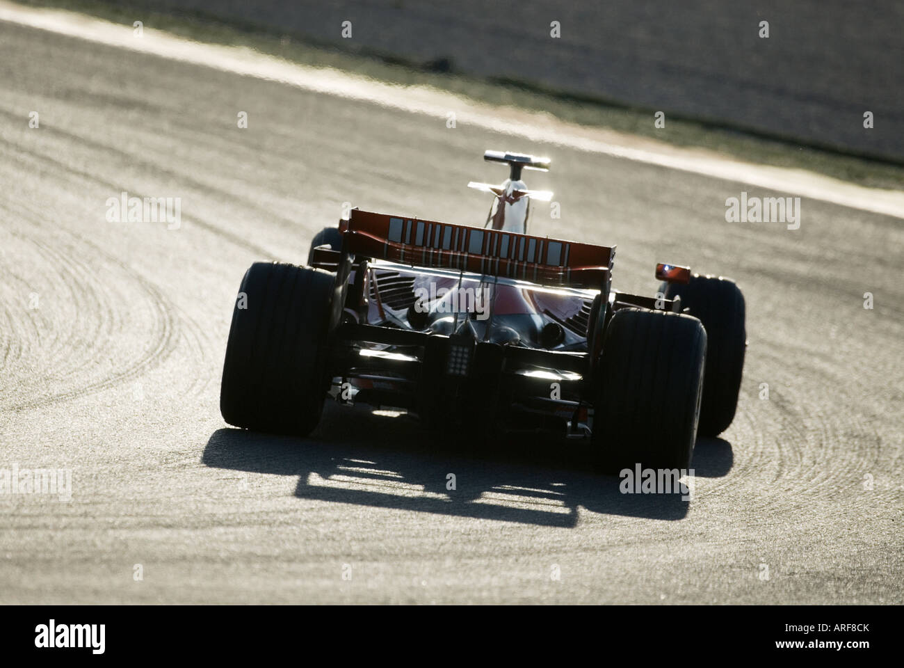 Ferrari F2008 Formula 1 racecar speeds through curve Jan.2008 Stock ...