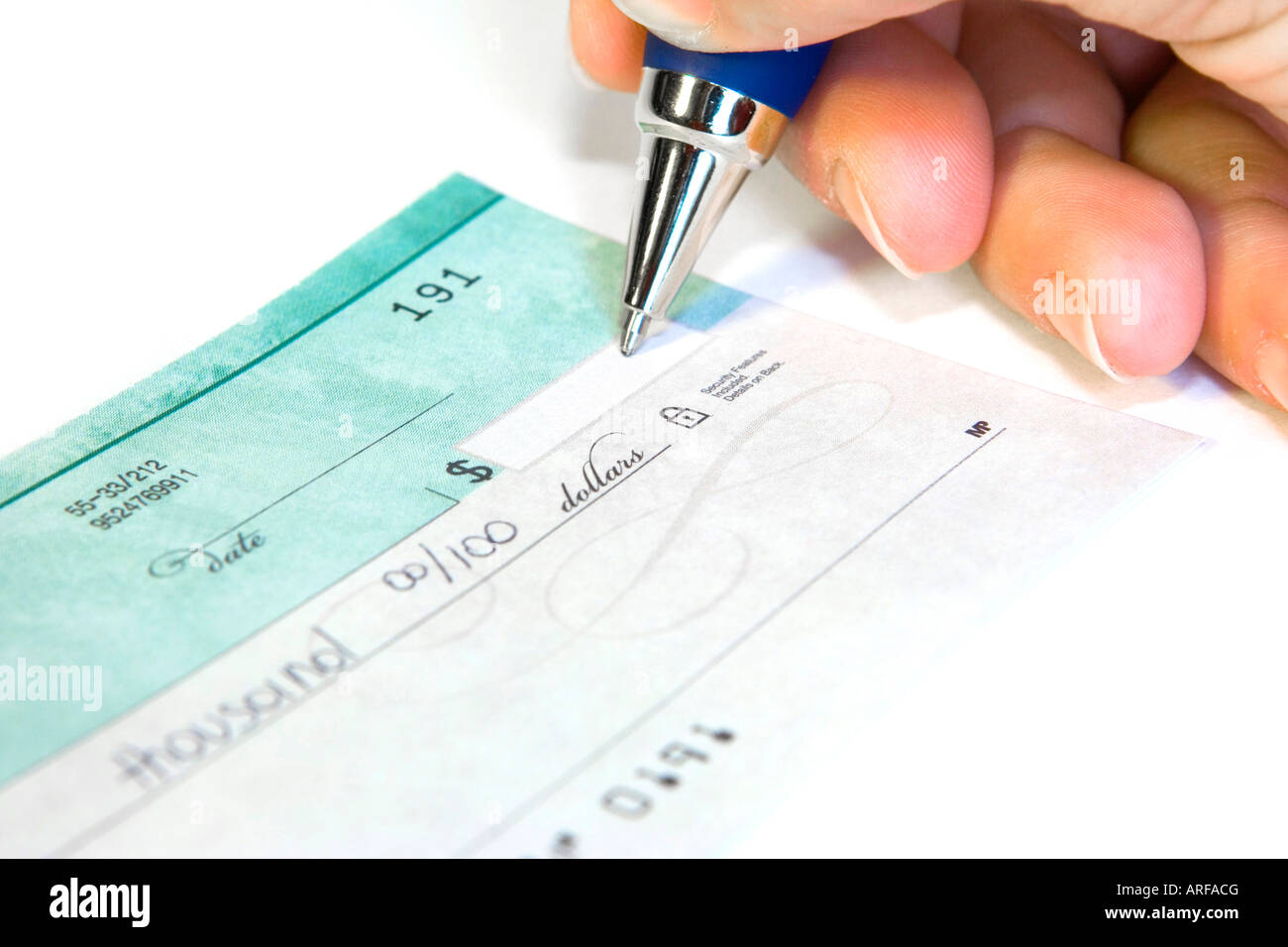Writing the check Stock Photo - Alamy
