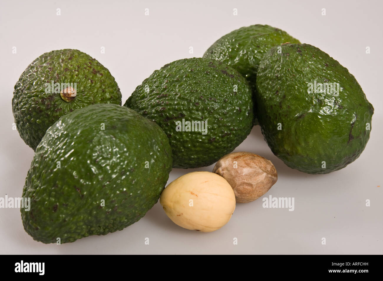 Natural ripe a green Avocado pear with seeds from above overhed ...