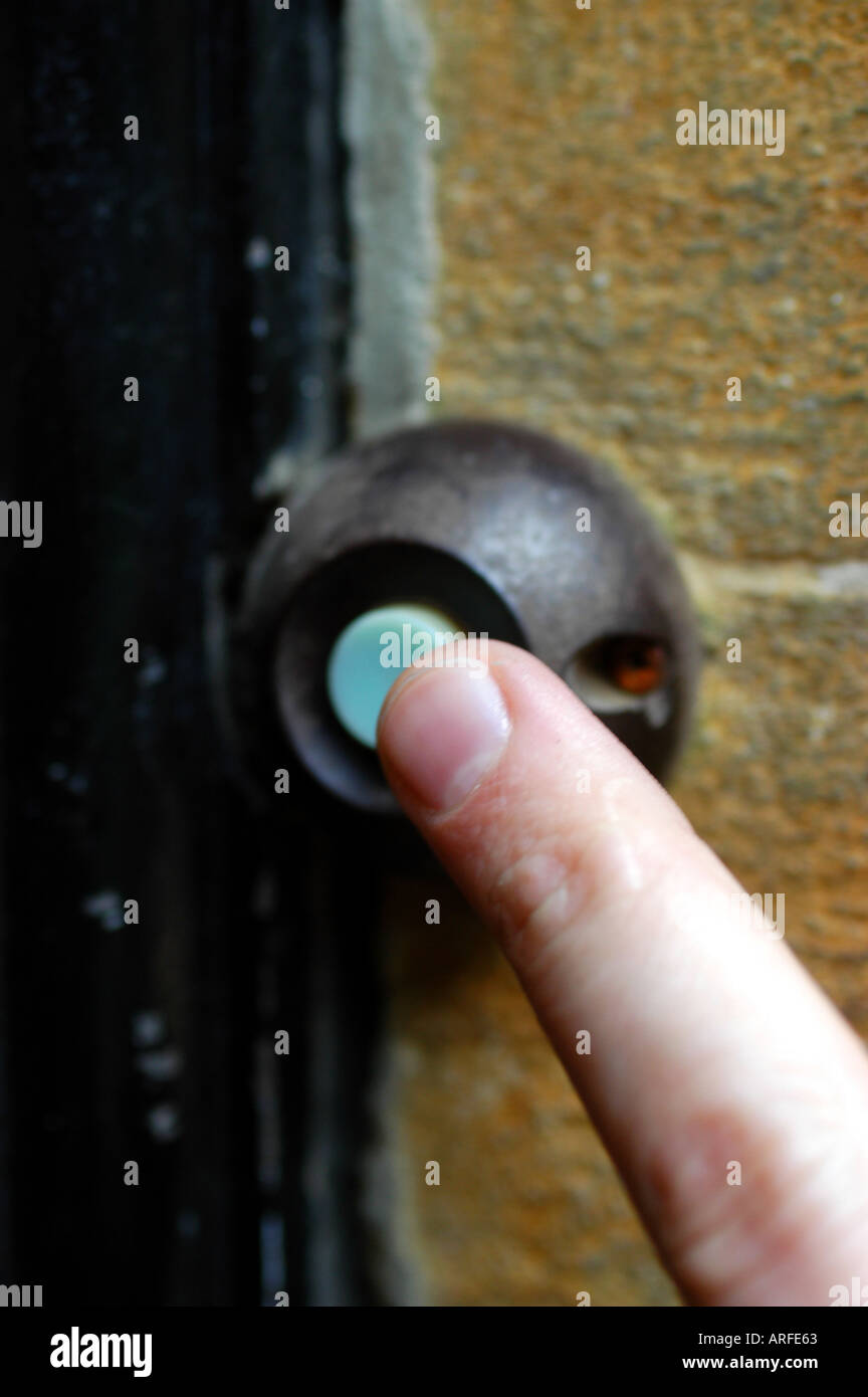 Finger about to ring a doorbell Stock Photo - Alamy