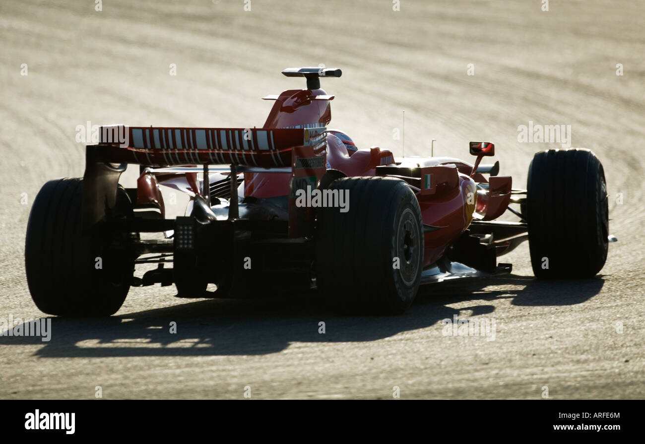 Ferrari F2008 Formula 1 racecar speeds through curve Jan.2008 Stock ...