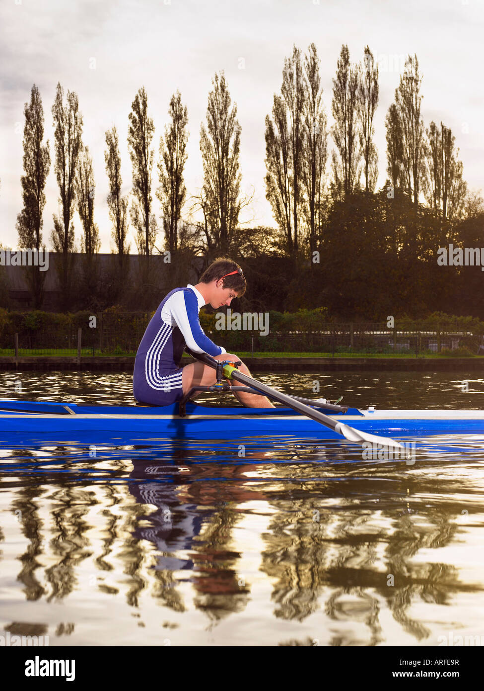 Skuller on river Stock Photo - Alamy