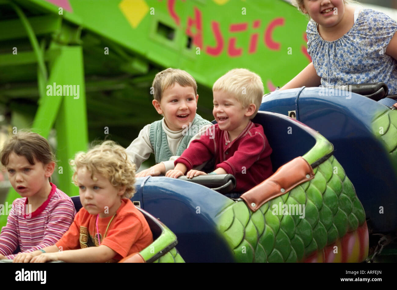 Young Children on Mini Roller Coaster Stock Photo - Alamy