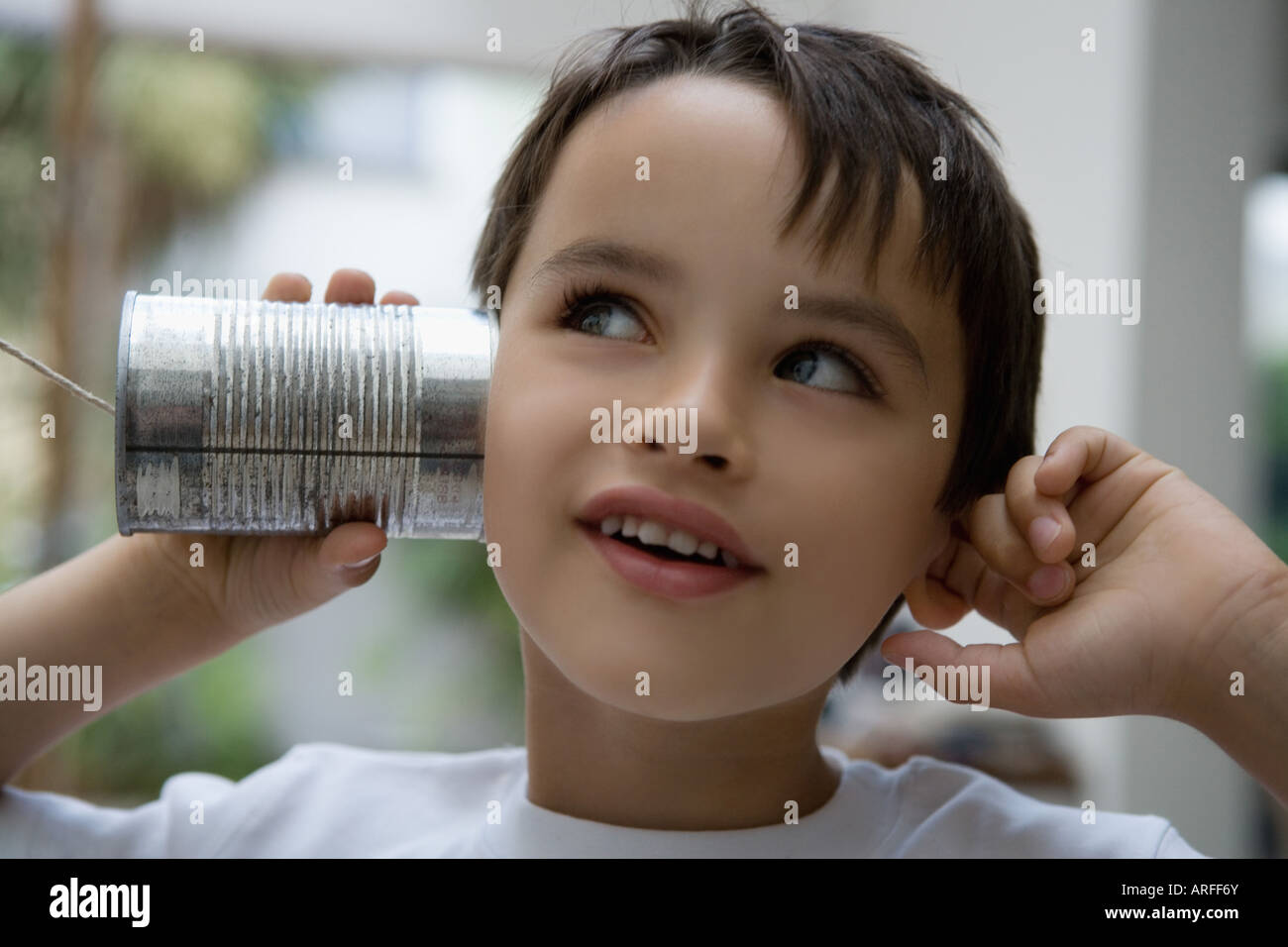Tin can phone child hi-res stock photography and images - Alamy