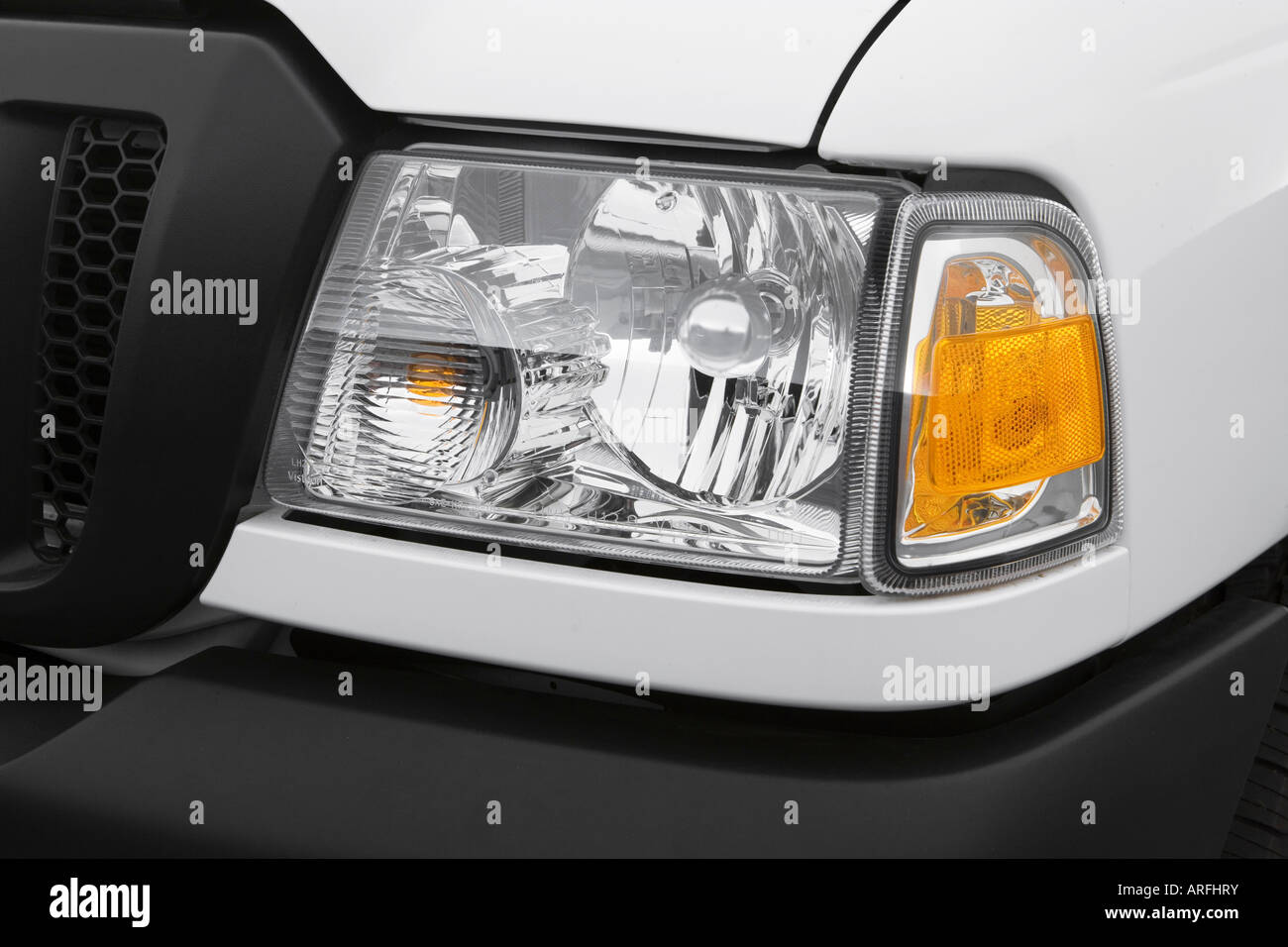 2007 Ford Ranger XL in White - Headlight Stock Photo - Alamy