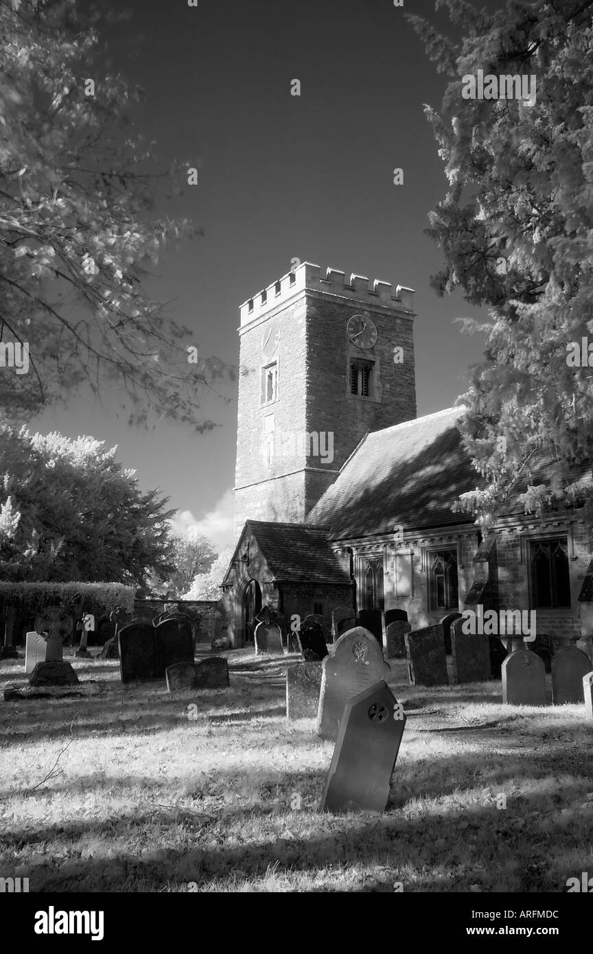 Graveyard in front of church stone bell tower England United Kingdom of ...