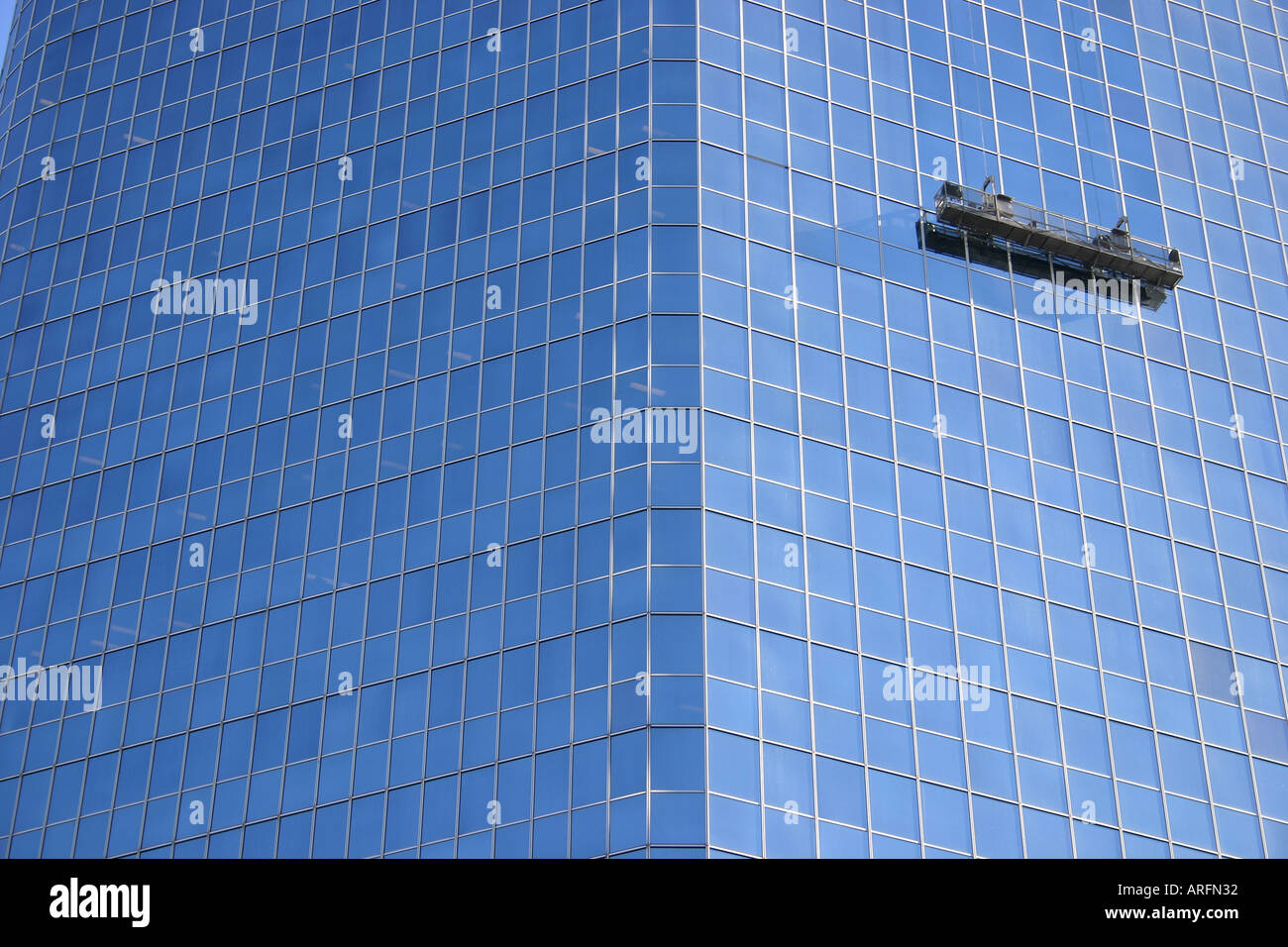 Modern building with men cleaning windows Stock Photo - Alamy