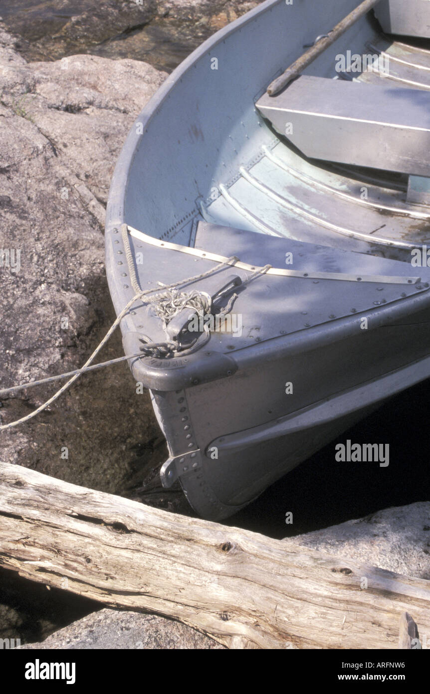 Aluminum Boat Tied Up to a Log on Northern Lake in Central Ontario ...