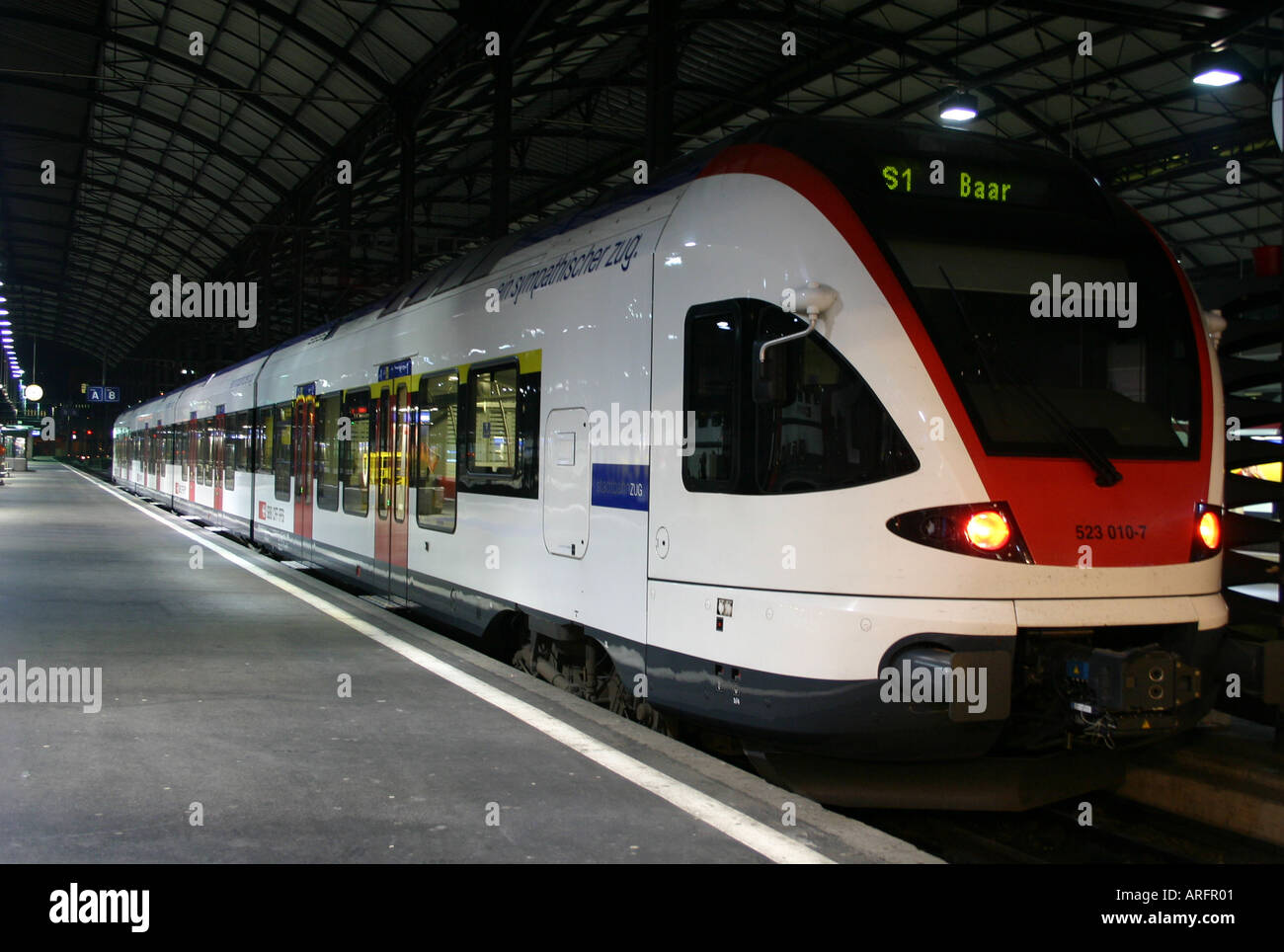 Electric multiple unit in Luzern station at night Stock Photo - Alamy