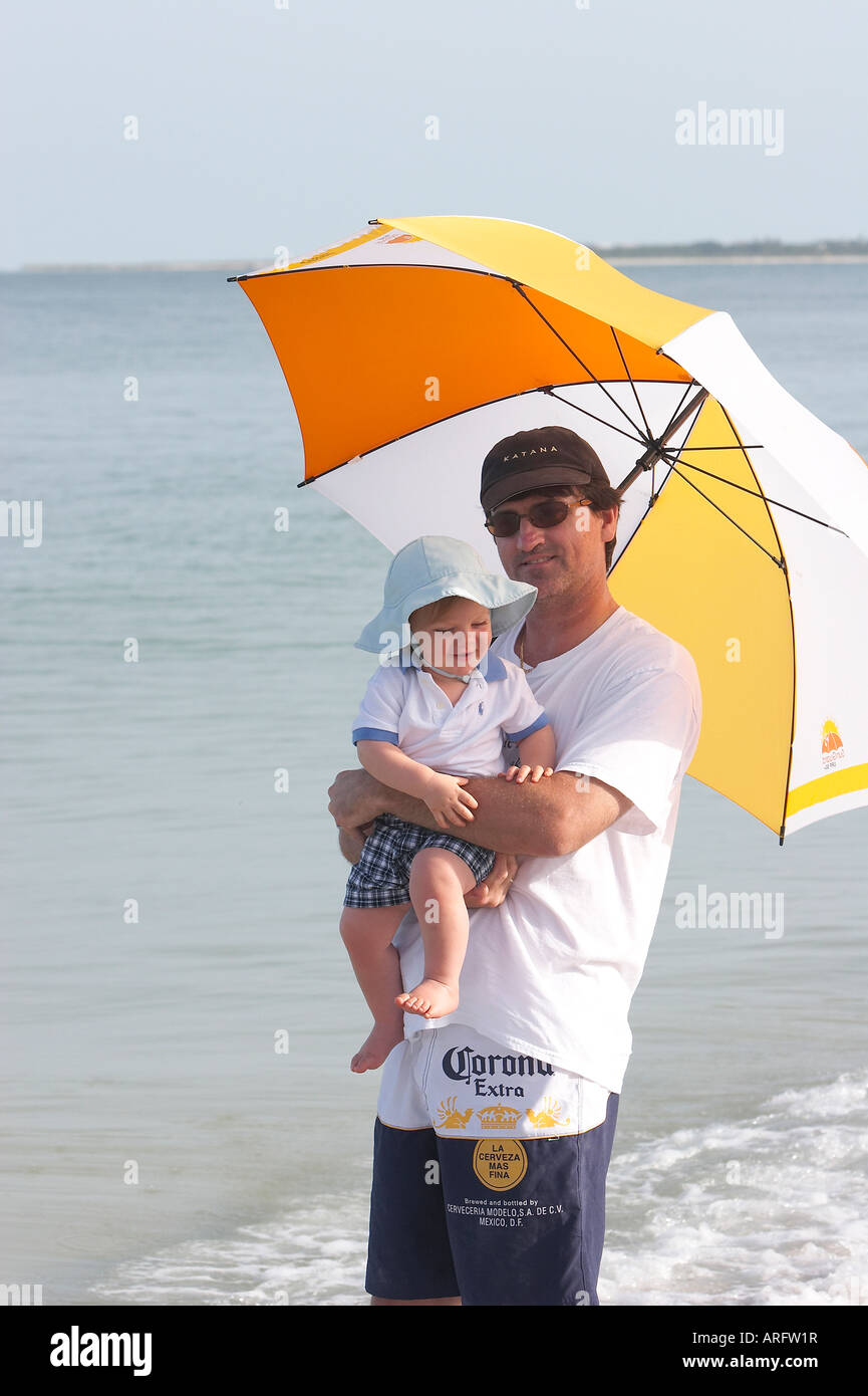 A father and son on the beach in front of the ocean Stock Photo - Alamy