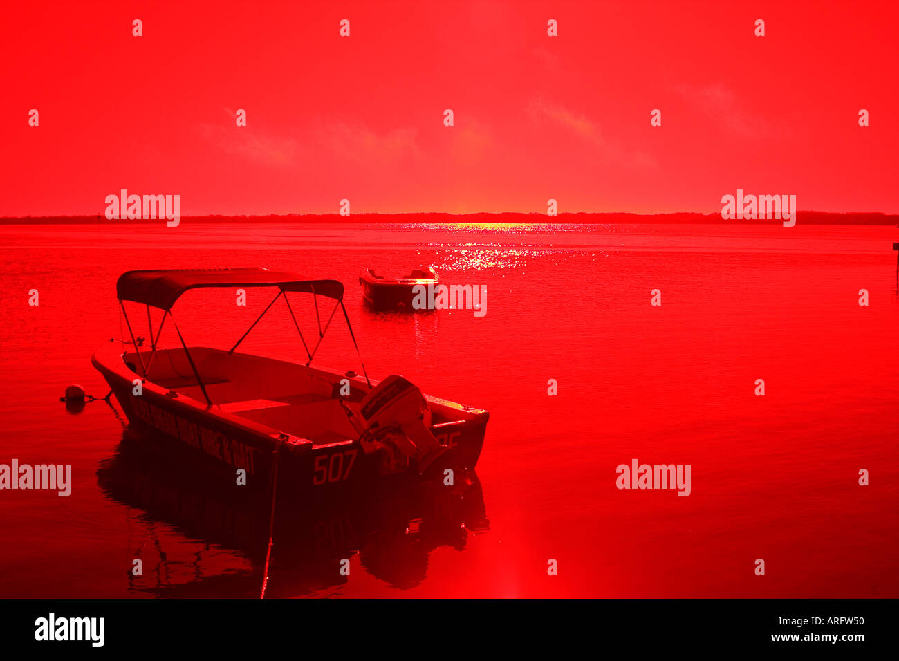 boat in blood red water Stock Photo - Alamy