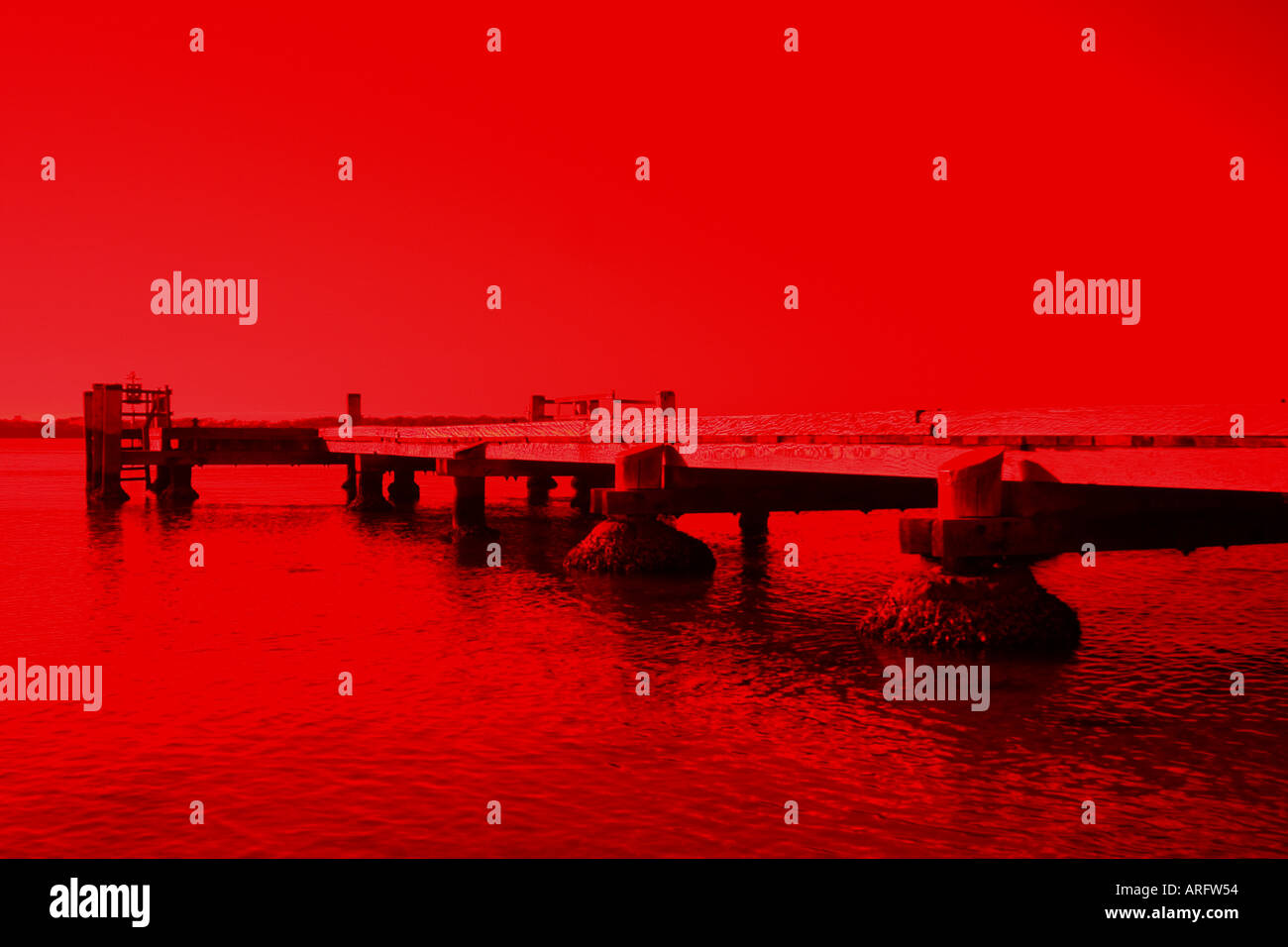 WHARF IN BLOOD RED WATER Stock Photo - Alamy