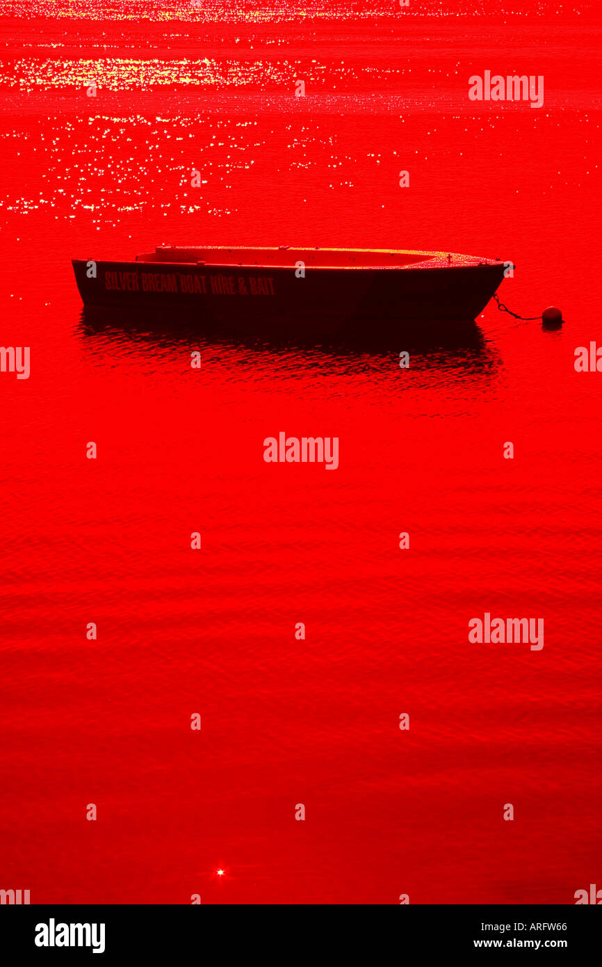 boat in blood red water Stock Photo - Alamy