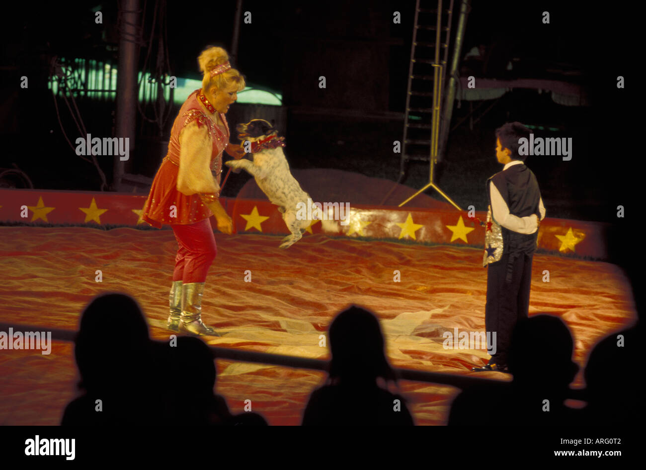 animal act dog jumps jumping rope audience Stock Photo - Alamy