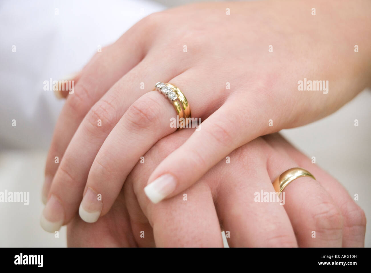 Hands with wedding rings Stock Photo - Alamy