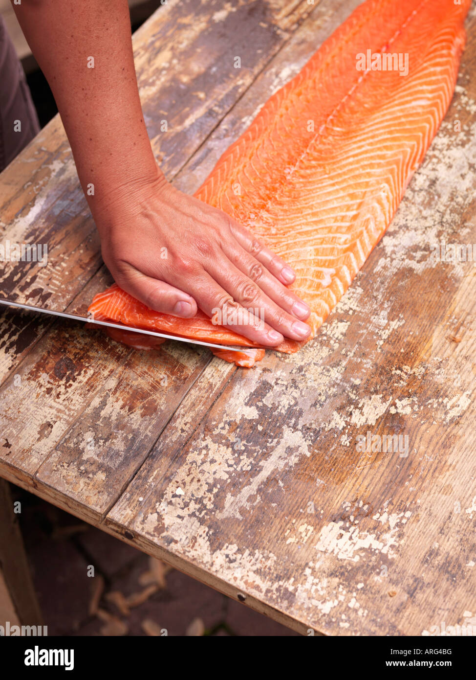 Person Slicing Fish Stock Photo - Alamy