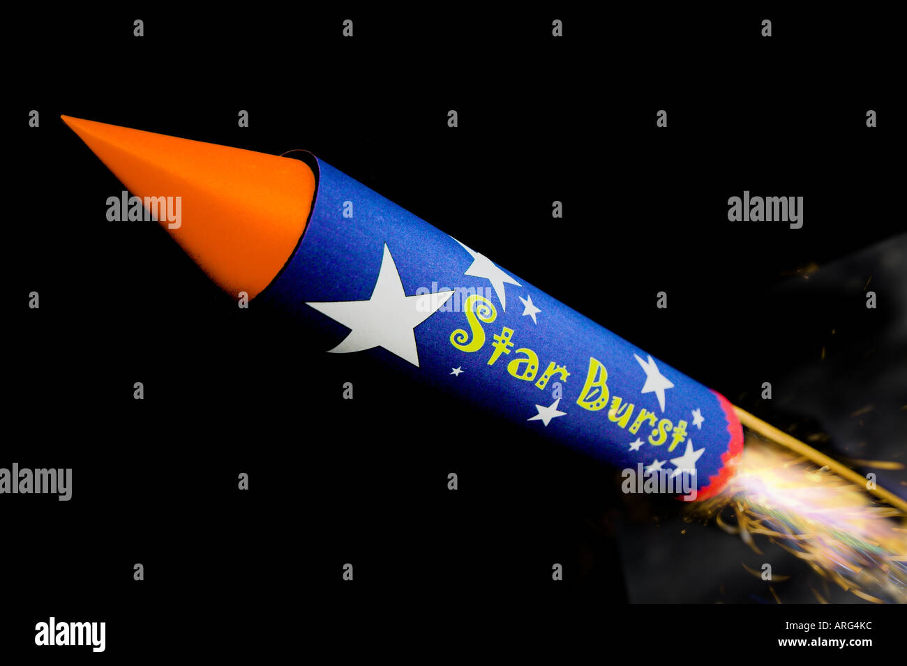 A firework rocket with trail of sparks captured against black Stock ...