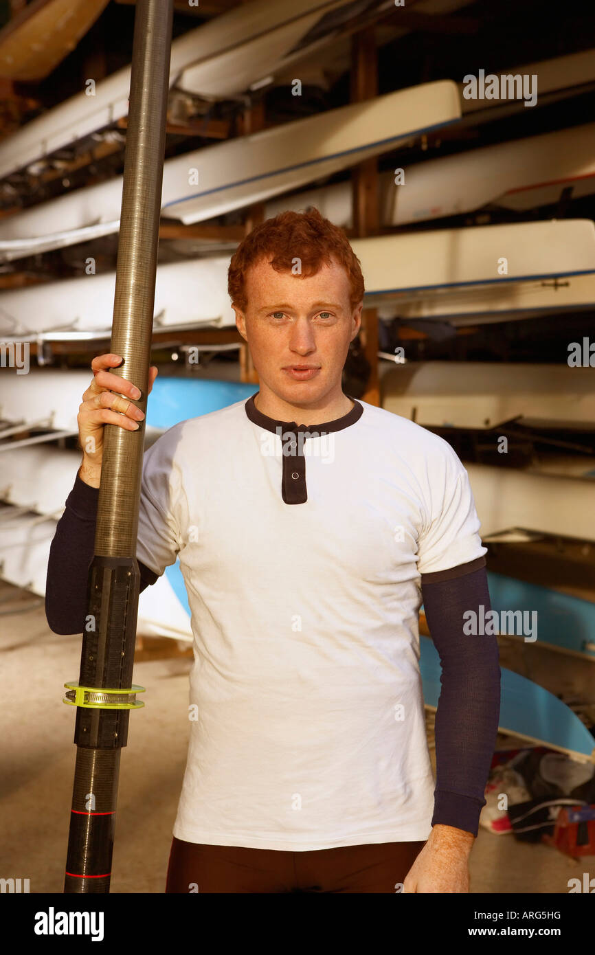 Oarsman outside boat shed Stock Photo - Alamy