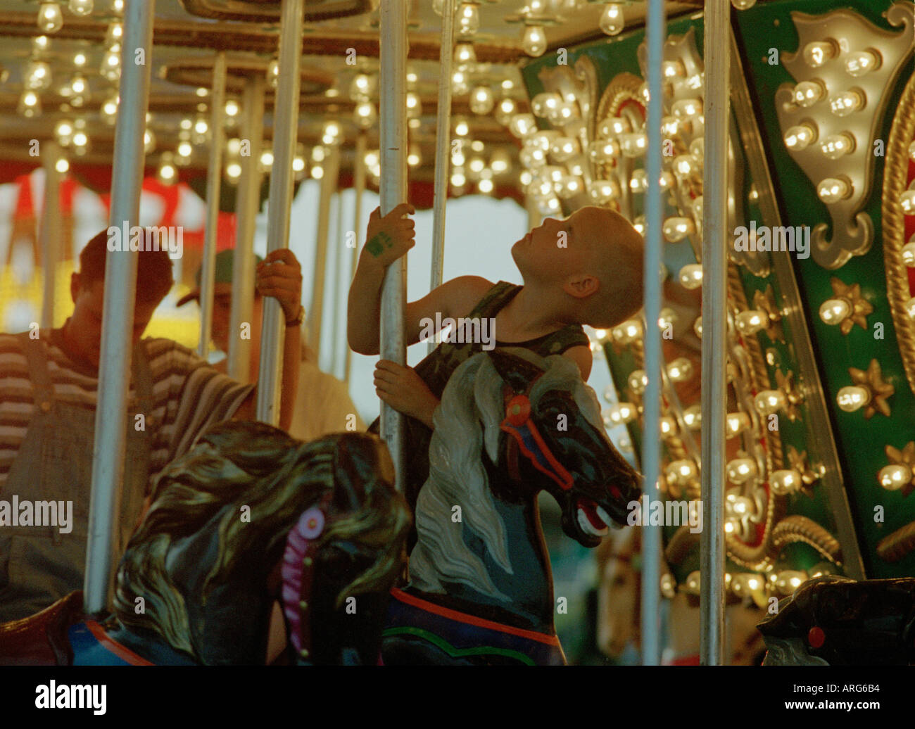 riding a merry go round Stock Photo - Alamy
