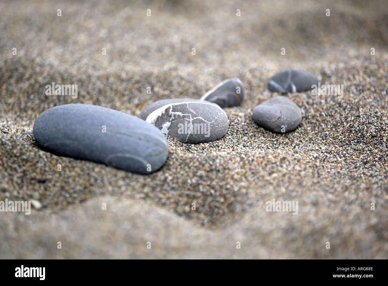 5 Stones on beach Stock Photo - Alamy
