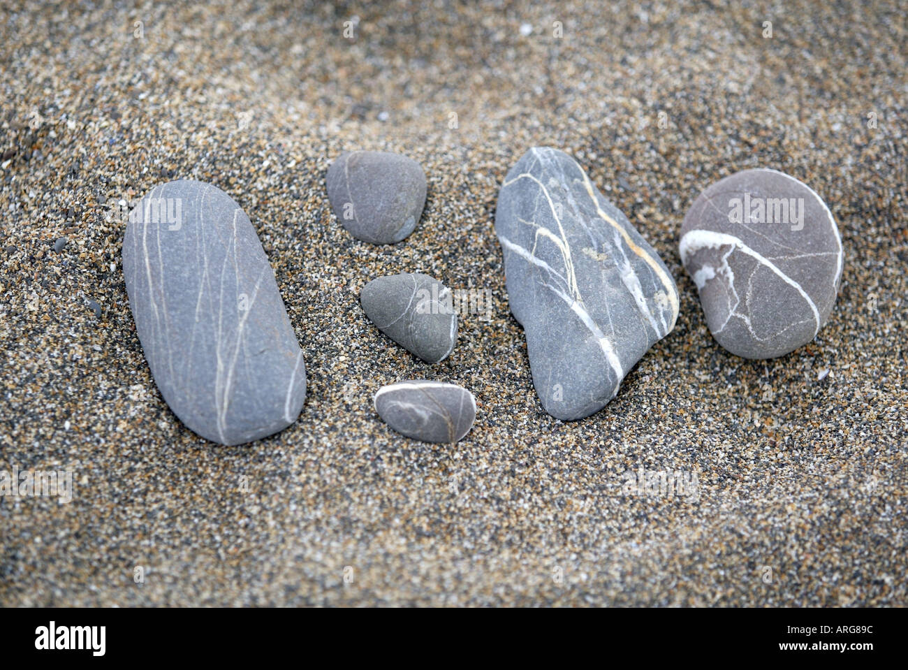 6 Stones on beach Stock Photo - Alamy