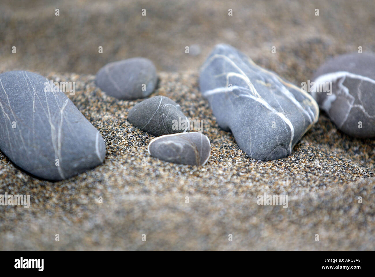 6 Stones on beach Stock Photo - Alamy