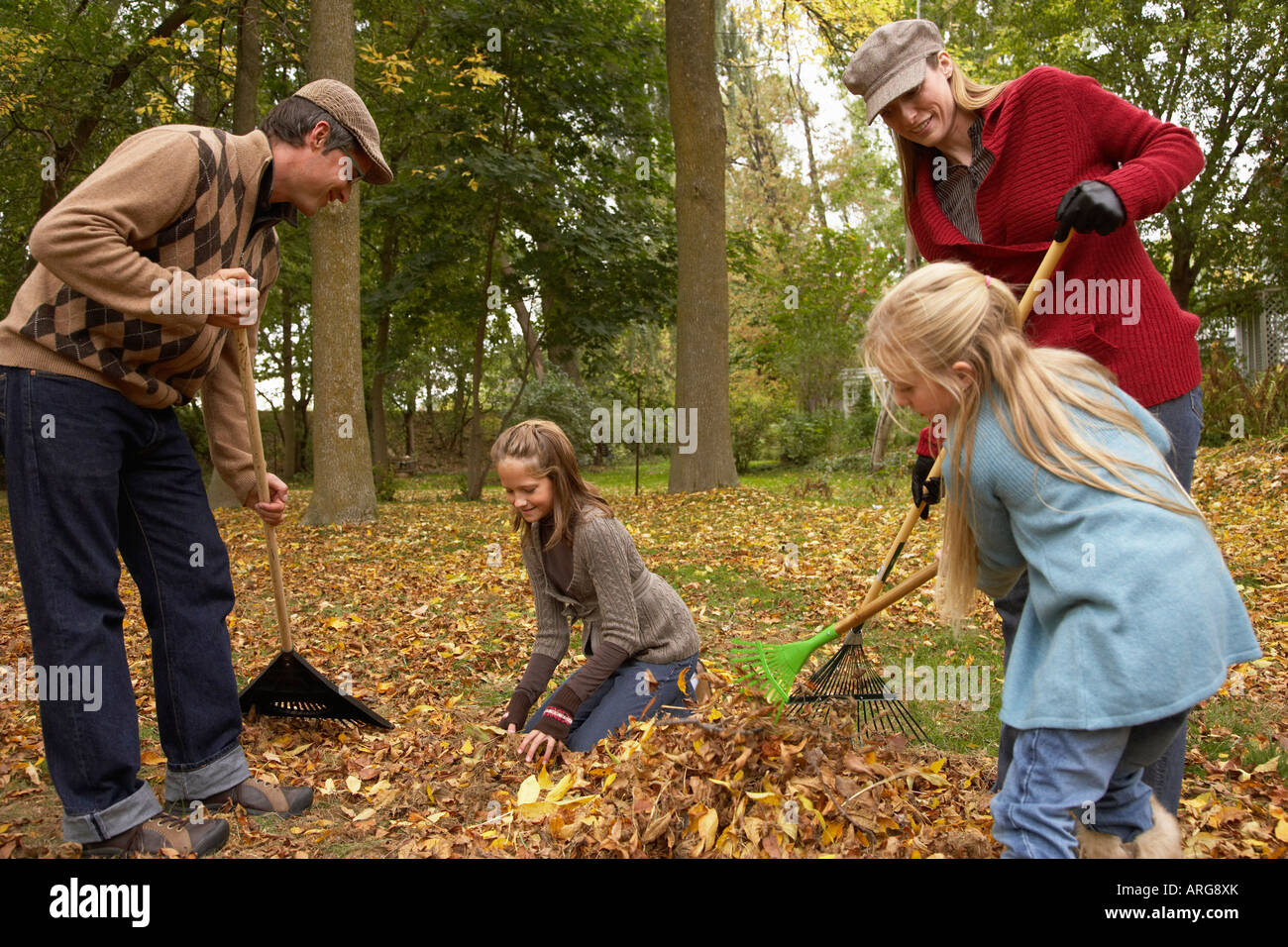 Little girl raking hi-res stock photography and images - Alamy