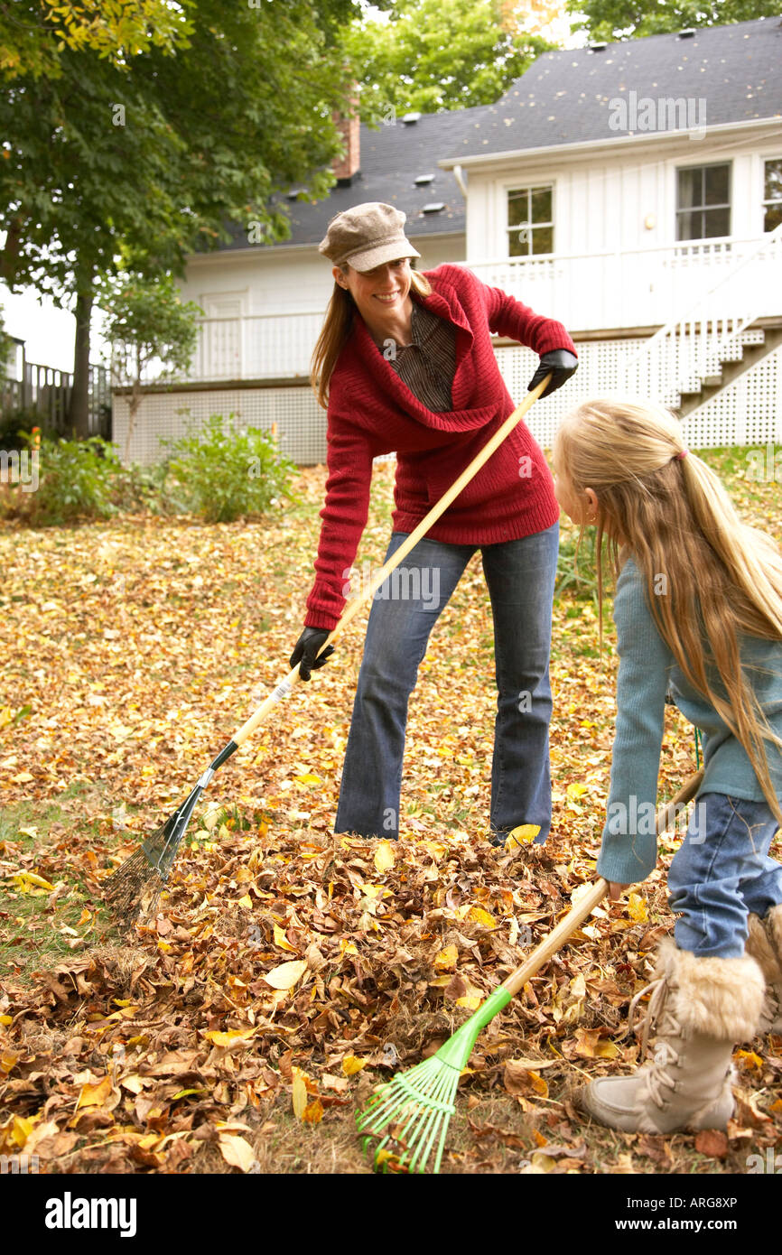 Little girl raking hi-res stock photography and images - Alamy
