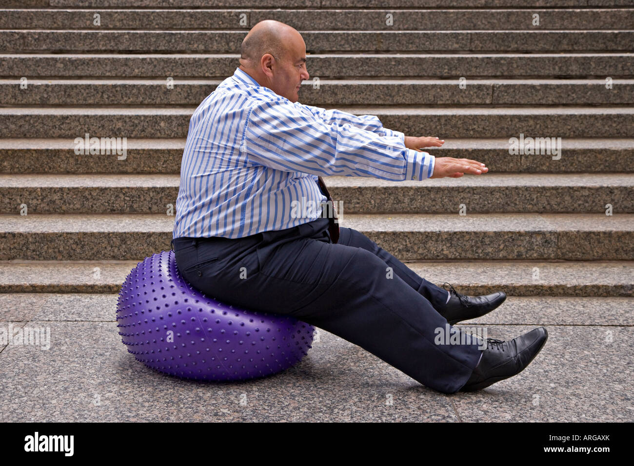 Businessman Using Exercise Ball Stock Photo - Alamy